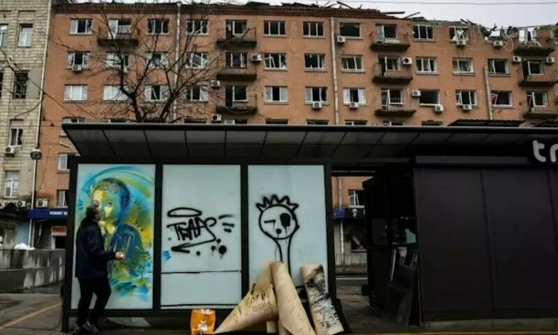 French artist sprays 'smiles and humanity' on Ukraine walls - World ...